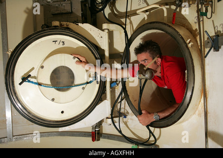 Divers training inside a hyperbaric chamber Stock Photo - Alamy