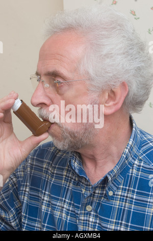 Older man using Becotide asthma preventer inhaler Stock Photo - Alamy