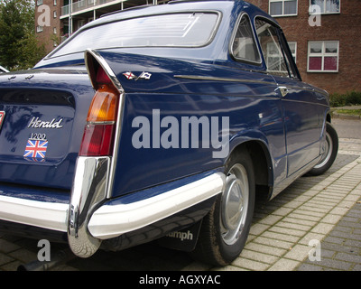 Classic light Blue Triumph Herald open top motor car parked on seafront ...