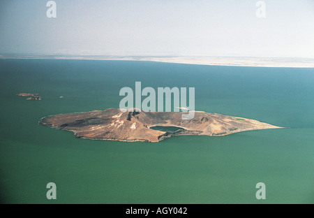 Kenya, Lake Turkana. A Nile perch comes to the surface near to the boat ...