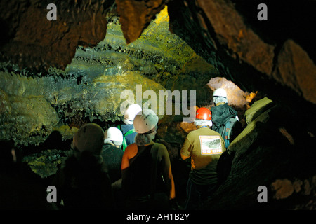 People visiting Gruta do Carvao lava tube cave. Sao Miguel island ...