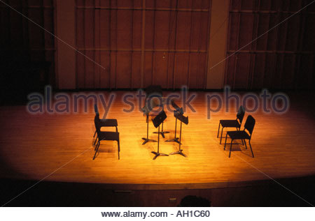 Empty stage with chairs and music stands before the concert. Arranged ...