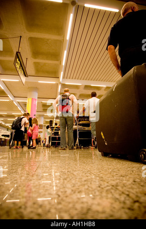 People in que waiting for check in at airport with baggage, Image Stock ...