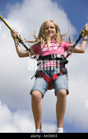 child on a bungee machine at Ambleside sports, Lake district, UK Stock ...