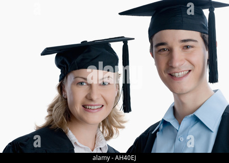 Young people in graduation gowns listen to a speech Stock Photo - Alamy
