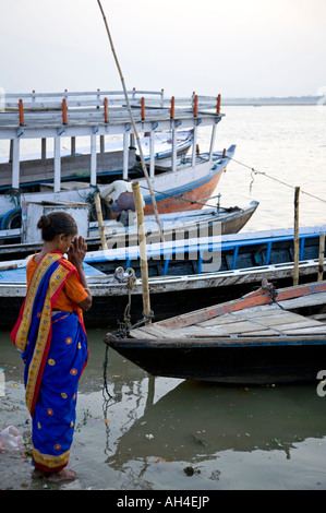 Woman praying. Shivala Ghat. Ganges river. Varanasi. India Stock Photo ...