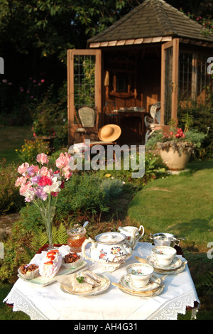 afternoon tea set on the lawn in English country garden Stock Photo - Alamy