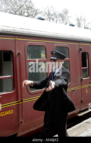 Steam Train guard signalling on Bodmin and Wenford Railway Cornwall ...