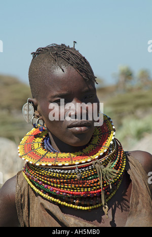 A turkana woman wears beads around her neck to show she is married ...