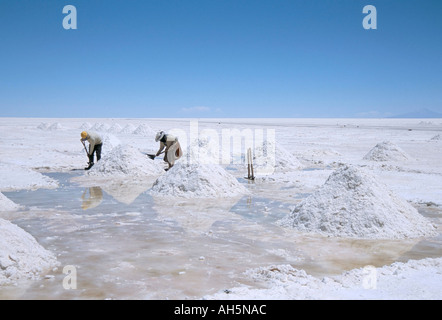Hand working in Colchani salt pans Salar de Uyuni salt flat Southwest ...