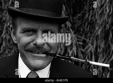 Actor Terry Thomas smoking a cigarette May 1959 Stock Photo - Alamy
