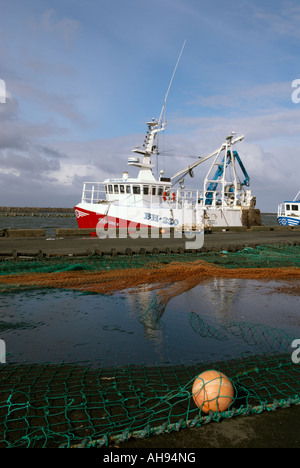 Red fishing boat in Amble harbour, UK Stock Photo - Alamy