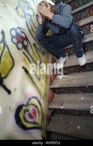 young man with problems in a demolition house Stock Photo - Alamy