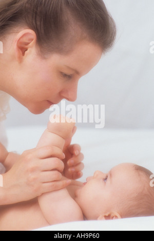 Mother interacting with her baby Stock Photo - Alamy
