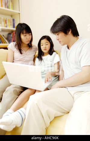 Woman and girl operating a computer Stock Photo - Alamy