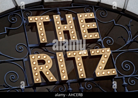 Illuminated sign and carving sculpture outside The Ritz Hotel London ...