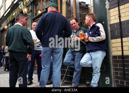 Men out together drinking at the local pub in London Stock Photo - Alamy