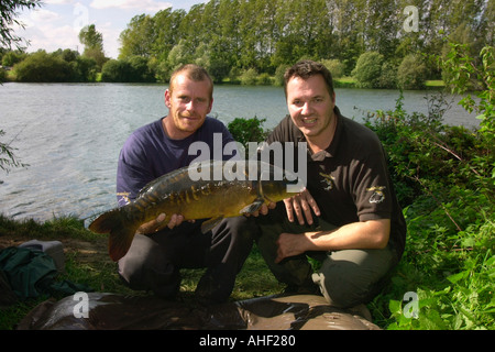 english countryside - Pair of carp anglers fishing at the Carp Society ...