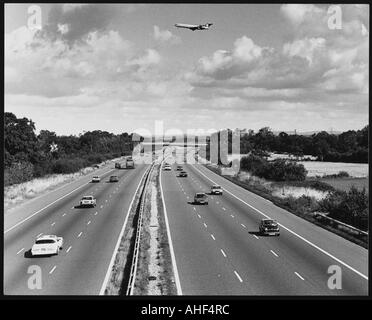 An aeroplane flying over the M23 Motorway towards London Gatwick ...