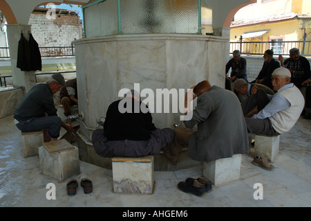 muslim men washing their feet before entering the Blue mosque for ...