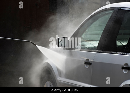 Hand car wash using pressurized water jet spray Stock Photo - Alamy