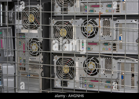 Steel cage containers containing piles of old computer components ...