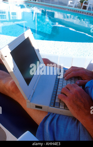 Businessman in suit with laptop in swimming pool. Crazy business man ...