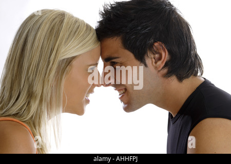 young couple going into a huddle Stock Photo - Alamy