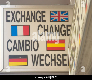 Sign for money exchange office with Spanish, American, British and ...