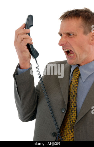 An angry businessman shouting down the phone Stock Photo - Alamy