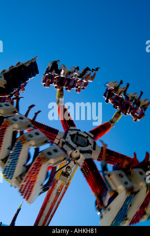 Action shot of carnival midway ride with riders Stock Photo - Alamy