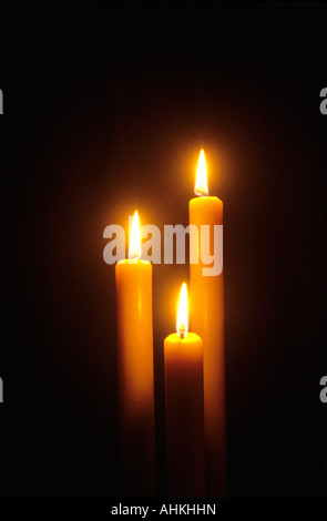Candles Lit in church, dark background Stock Photo - Alamy