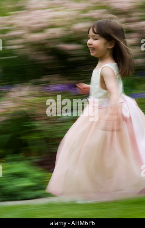 Female child happily running Stock Photo - Alamy