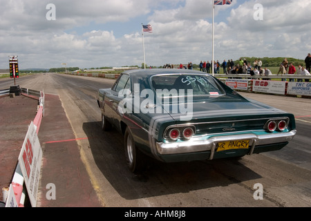 Heavily modified American muscle car on start line at drag race Stock ...