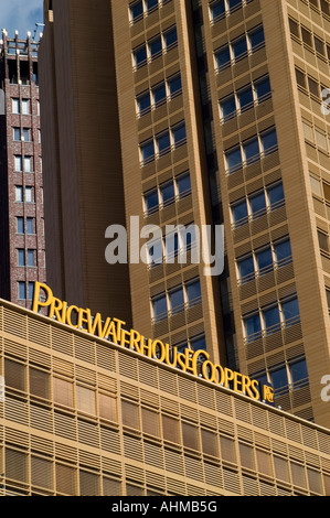 PricewaterhouseCoopers Modern building. Berlin wall pieces and cobble ...