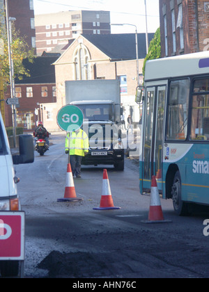 Manual Traffic Control during roadworks 3 Stock Photo - Alamy