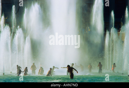 People cool off at Trocadero fountain near the Eiffel Tower during a ...