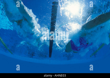 2 women diving into swimming pool Stock Photo - Alamy