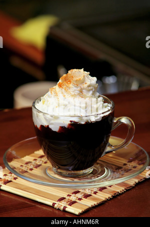 a hot coffee with cream in cafe Stock Photo - Alamy