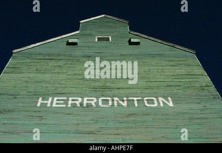 Horizontal Grain elevator trucks and train tracks Stock Photo - Alamy