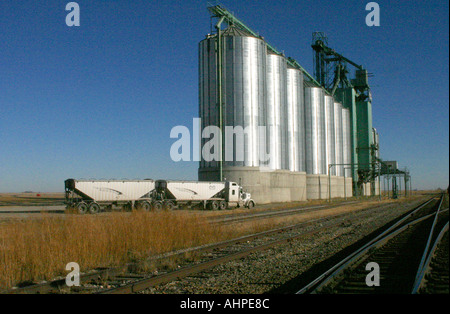 Grain elevator trucks and train tracks Horizontal Stock Photo - Alamy