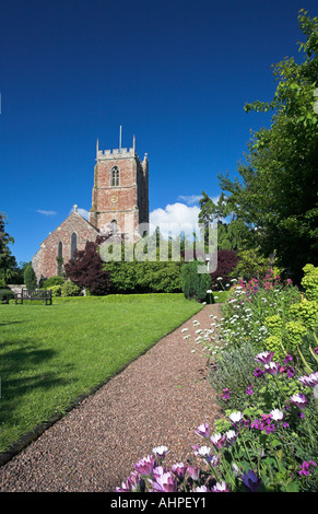 Dunster parish church of St George viewed from the Dream Garden at ...