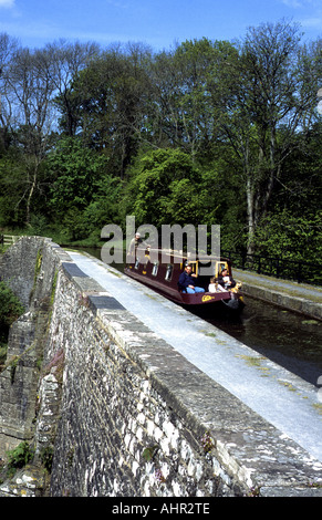 Narrow boat crossing Brynich Aqueduct over the River Usk on the Mon ...