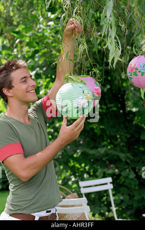 man holding a lampshade Stock Photo - Alamy