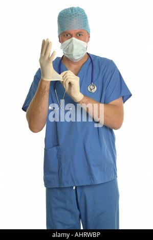 Doctor in latex gloves and face shield filling in syringe from bottle ...