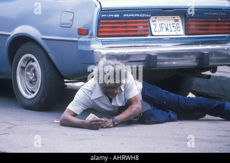 Fallen homeless man laying on city street Los Angeles California Stock ...