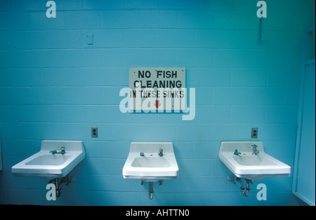 A sign that reads No fish cleaning in these sinks Stock Photo - Alamy