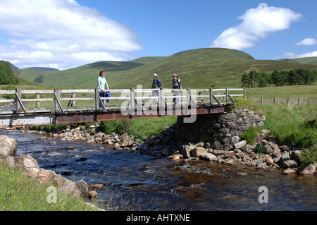 Glen Isla Walkers crossing the timber bridge over the River Isla Angus ...