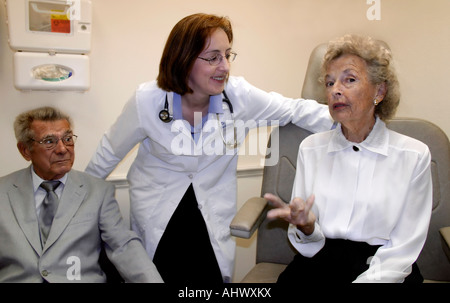 Female doctor geriatrician discusses healthy aging issues with elderly ...