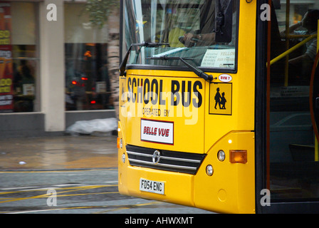 yellow school bus in manchester england Stock Photo - Alamy